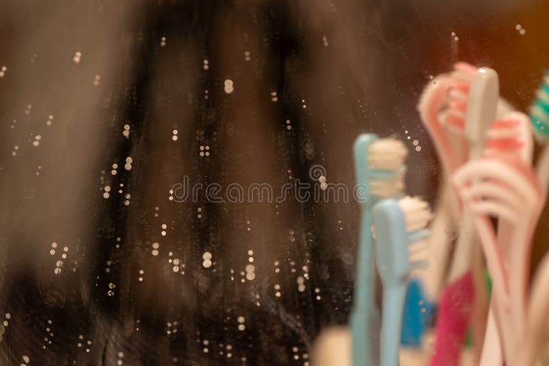 Toothpaste and Toothbrushing Stains on the Mirror. Stock Photo - Image ...