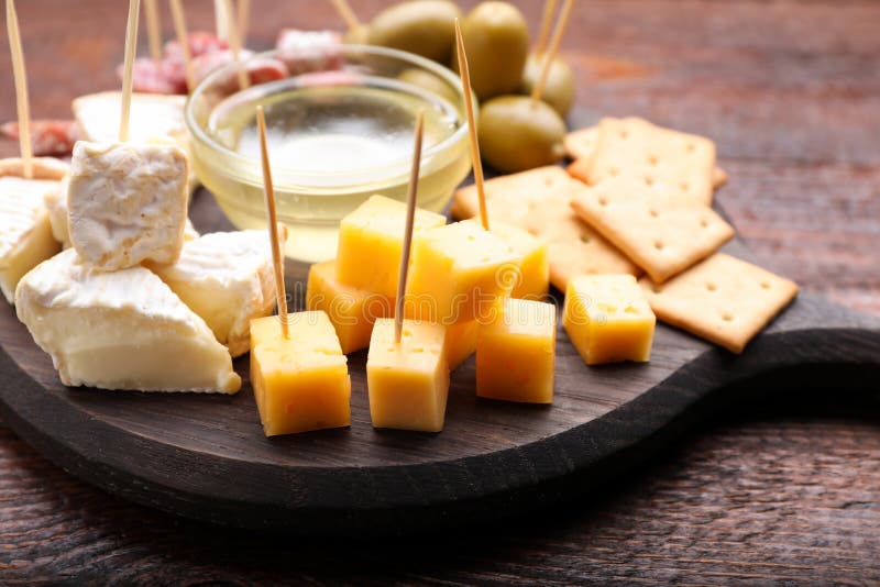 Toothpick Appetizers. Pieces of Different Cheese on Wooden Table ...