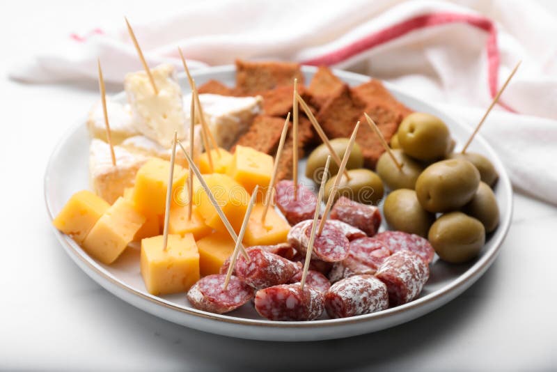 Toothpick Appetizers. Pieces of Sausage, Cheese and Olives on White ...