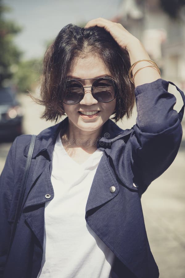 Toothy Smiling Face of Beautiful Asian Woman Relaxing with Happiness ... Toothy Smiling Face of Beautiful Asian Woman Relaxing with Happiness ...
