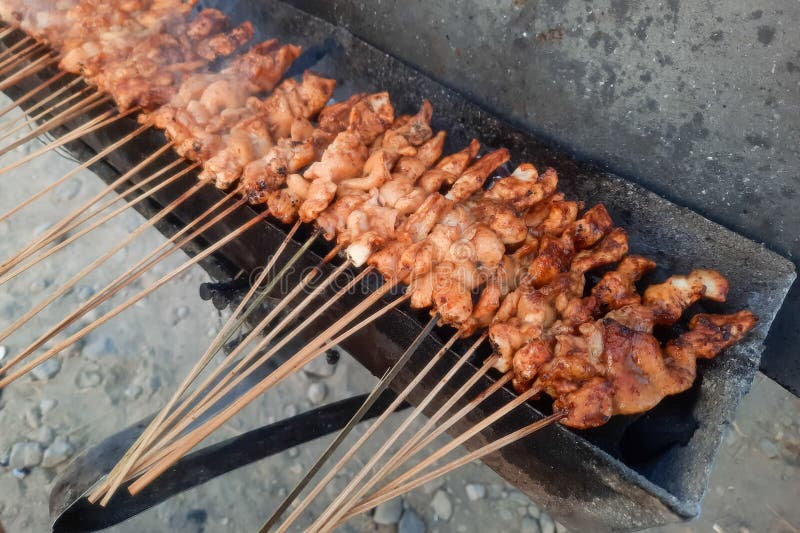 Top Angle View of Chicken Satay on the Grill. Marinated Chicken Satay ...