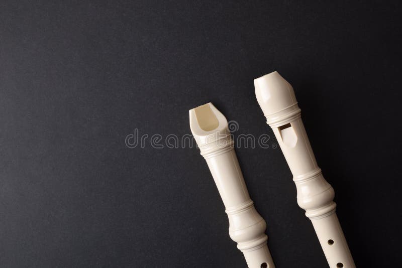 Top and Bottom View of Recorder Mouthpiece on Black Table Stock Image ...