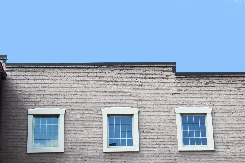Top of Brick Commercial Building with Three Windows Stock Photo - Image ...