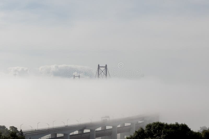 Top of the Bridge Stick Out of the Thick Dense White Fog Stock Photo ...