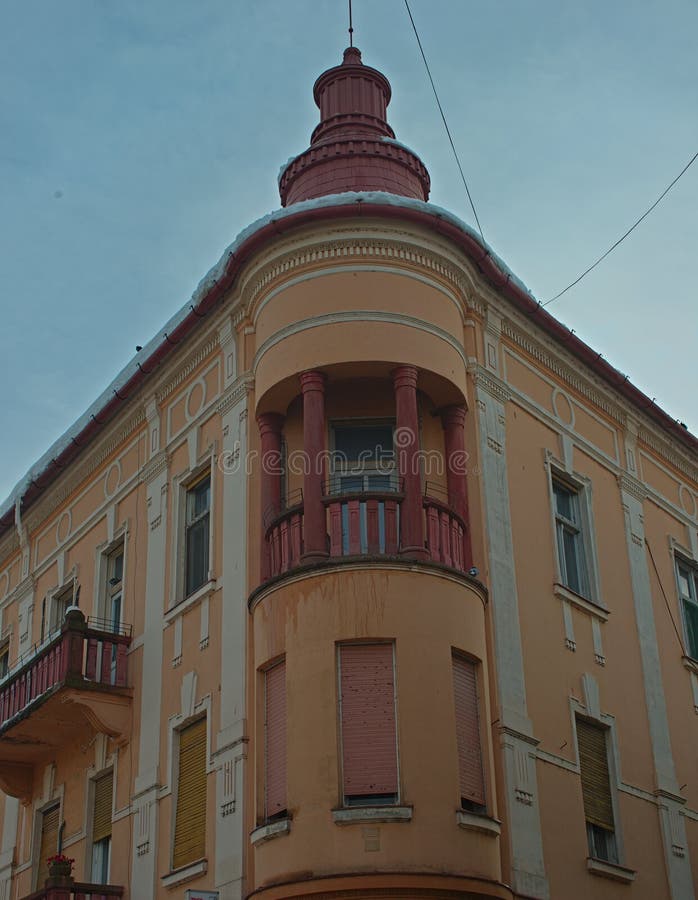 Top Corner of an Old Style Building with an Orange Facade Stock Photo ...