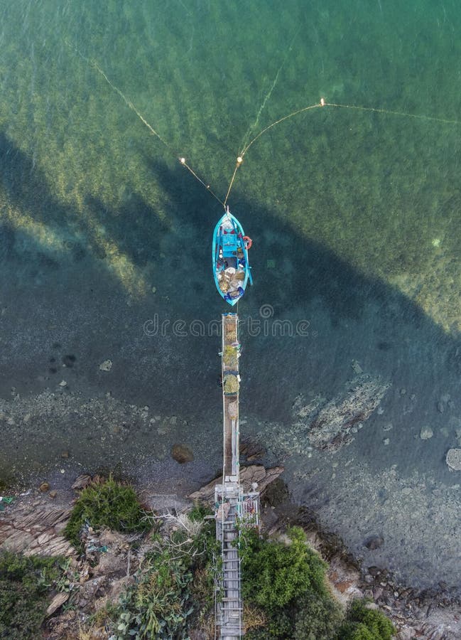 Top Down Aerial View of a Boat Moored To a Dock Stock Photo - Image of ...