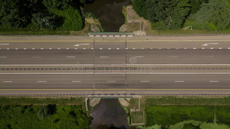 Top Down Close Up of Highway, White Arrow Signs Indicating Direction ...