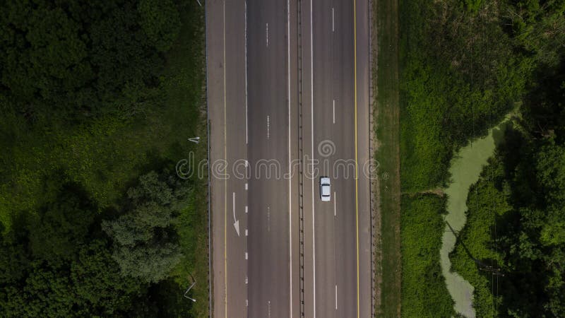 Top Down Close Up of Highway, White Arrow Signs Indicating Direction ...