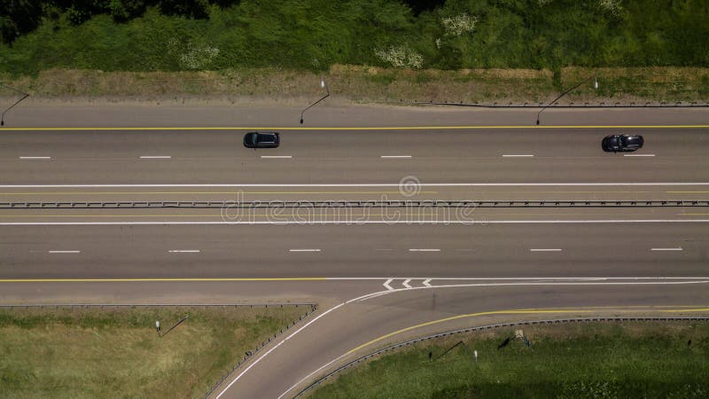 Top Down Close Up of Highway, White Arrow Signs Indicating Direction ...