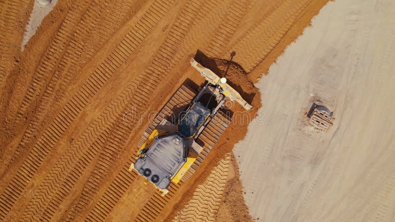 Top Down Drone Shot of a Bulldozer Working on the Construction Site ...