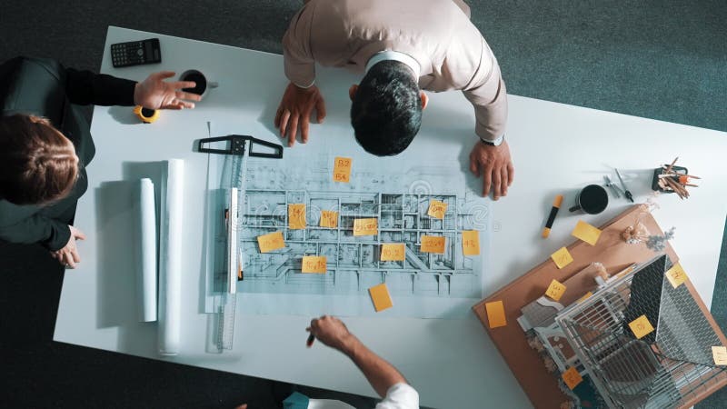 Top View of Engineer Writing Idea on Note and Stick on Blueprint ...