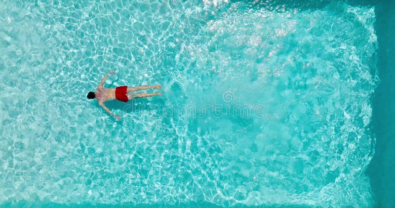 Aerial View As a Man Dives into the Pool and Swims. Stock Video - Video ...