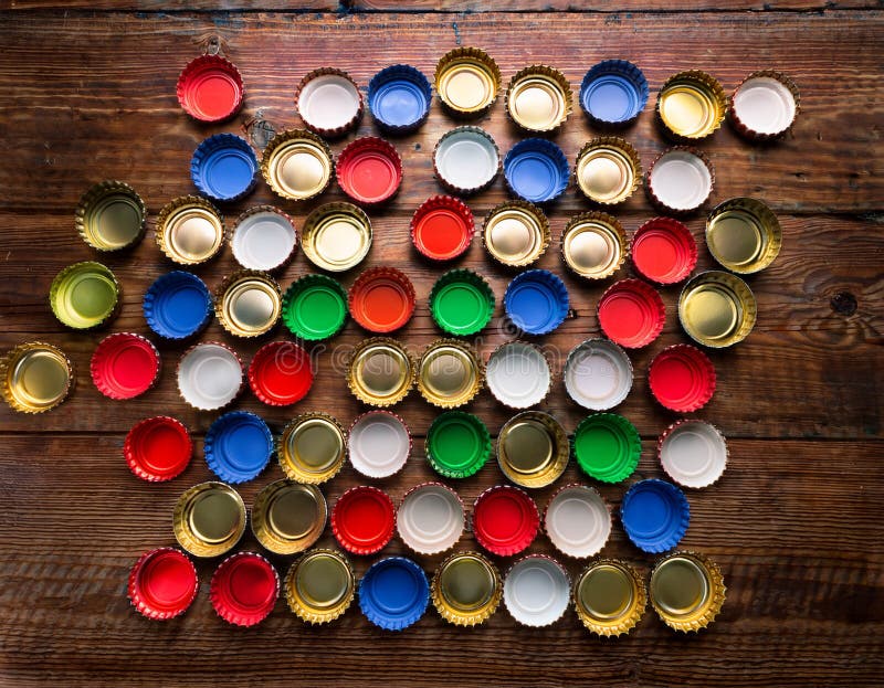 A Top-down View of Assorted Beer Caps Creating a Colorful Mosaic-like ...