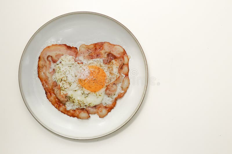 A Top-down View of a Breakfast Dish Featuring a Fried Egg with a Runny ...