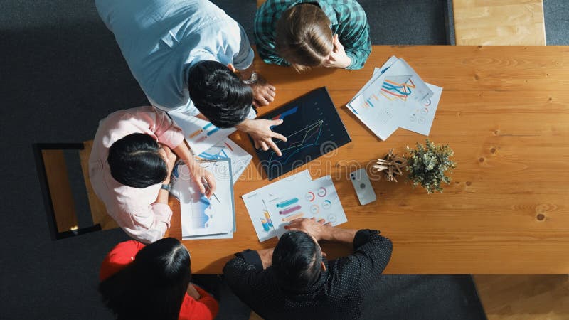Top Down View of Business People Analyze Data Together at Meeting ...