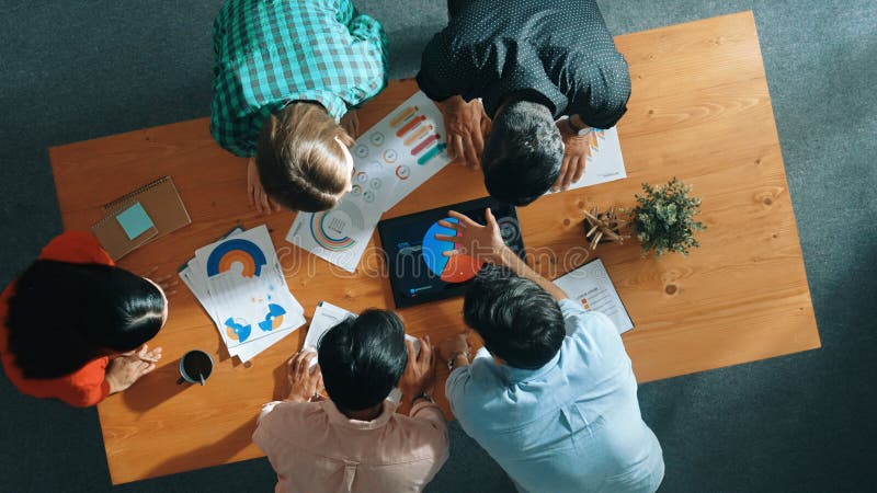 Top Down View of Business People Analyze Data Together at Meeting ...