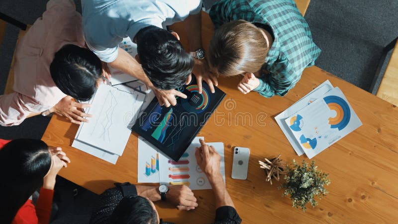 Top Down View of Business People Analyze Data Together at Meeting ...