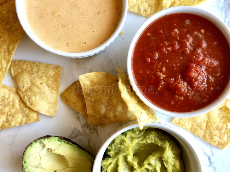 Chips and dips stock photo. Image of salty, guacamole - 165688052