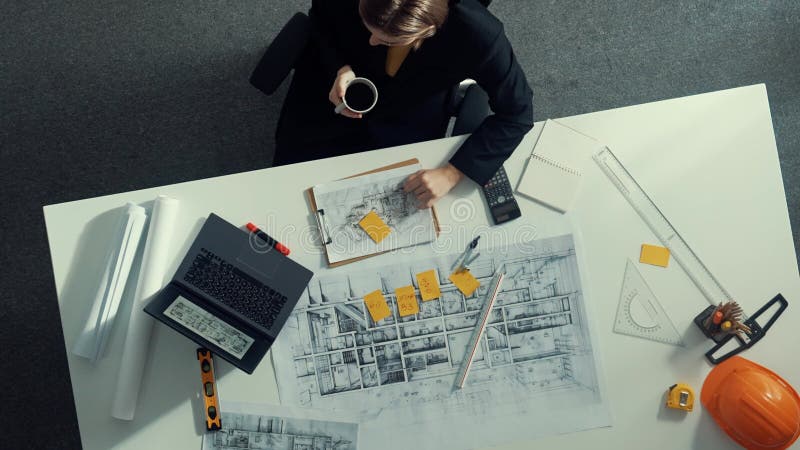 Top View Civil Engineer Writing Sticky Note and Looking at Laptop ...