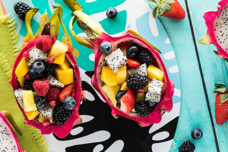 Top Down View of Colourful Dragon Fruit Bowls Against an Abstract ...