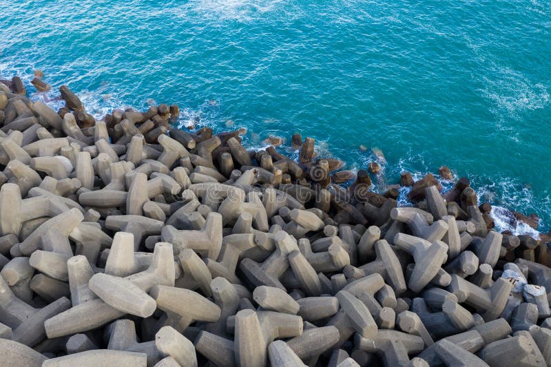 Concrete wave breaker stock image. Image of spray, wave - 245480541