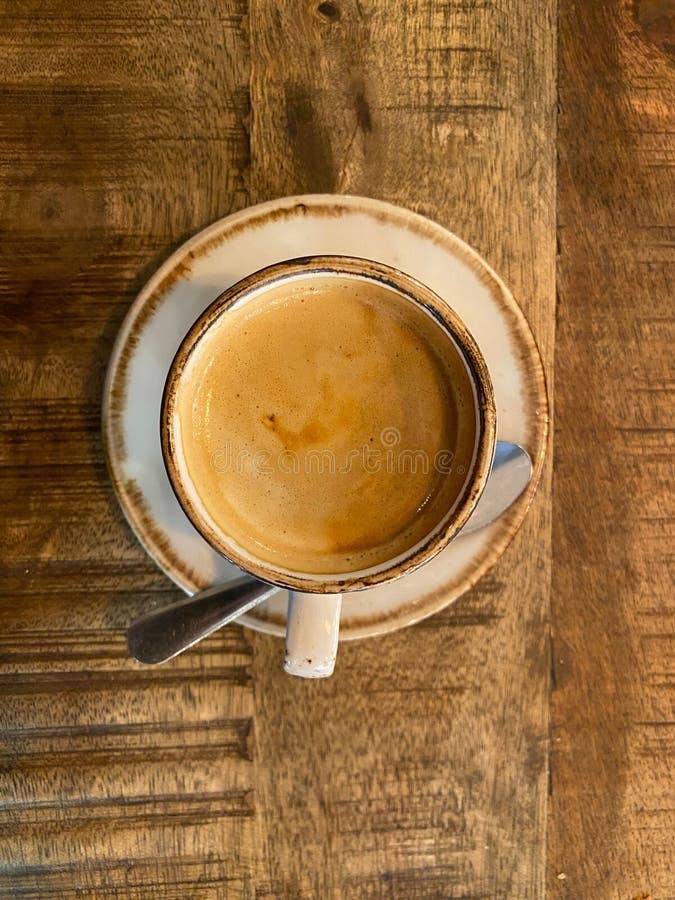 Top-down View of a Cup of Coffee on a Rustic Wooden Table Stock Image ...