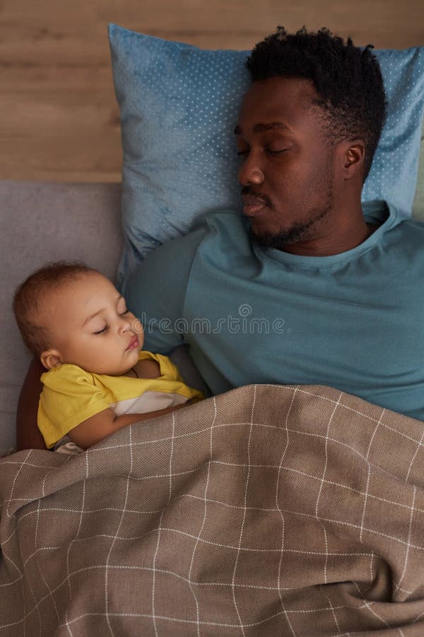 Top Down View of Exhausted Black Man Sleeping with Cute Baby Boy at Nap ...
