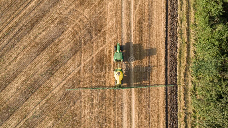 Top Down View of Farming Tractor Spraying on Field. Protection of ...