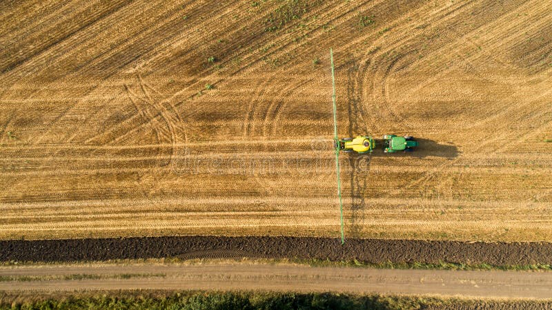 Aerial View of Farming Tractor Spraying on Field. Protection of Plants ...
