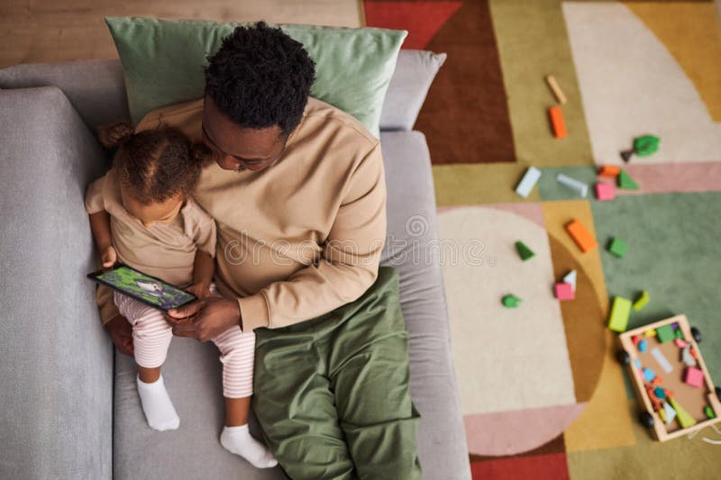 Top Down View at Father and Daughter Playing Games with Digital Tablet ...
