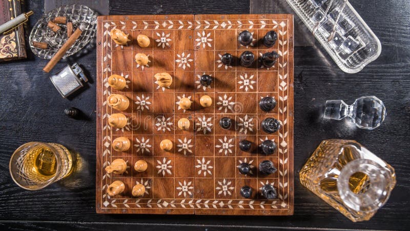 Top Down View of a Game of Chess with a Glass of Whiskey Stock Image ...