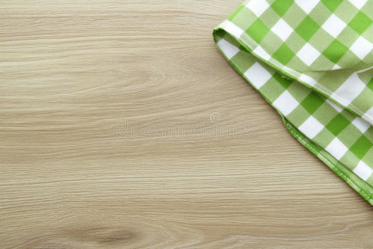 A Top-down View of a Green Checkered Tablecloth on a Wooden Surface ...