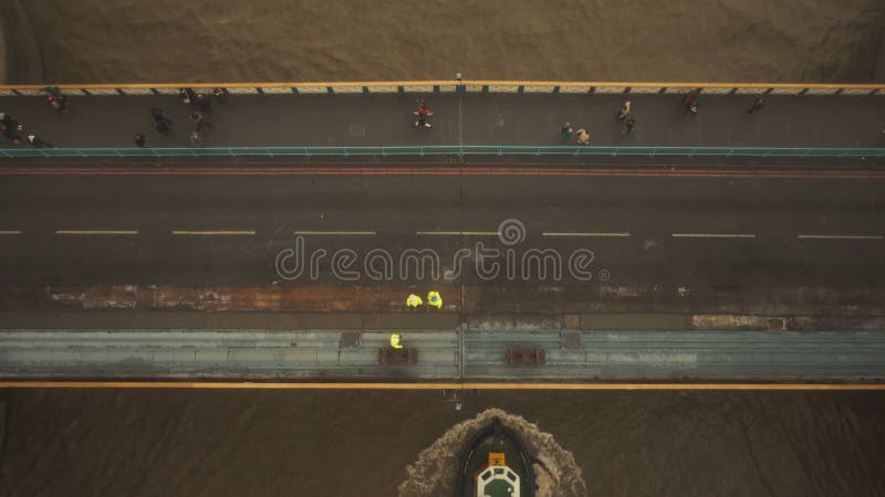 Top Down View of a Large Barge Passing Under Tower Bridge in London, UK ...