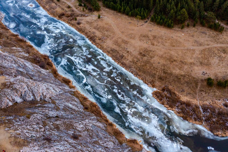 Top Down View Over Snowy River Valley with Partially Frozen River ...
