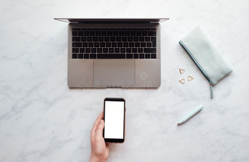 Top Down View of a Person Holding a Mobile Phone Over a Desk Stock ...