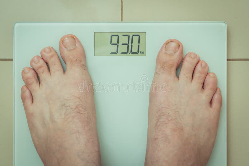 Top Down View of a Person Standing on Bathroom Scales Stock Photo ...