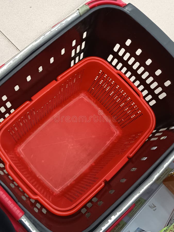 Top-Down View of a Red Shopping Basket Nested Inside a Rolling Cart at ...