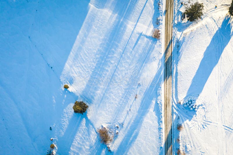 Top Down View of Road and Snowy Field in Winter Stock Photo - Image of ...
