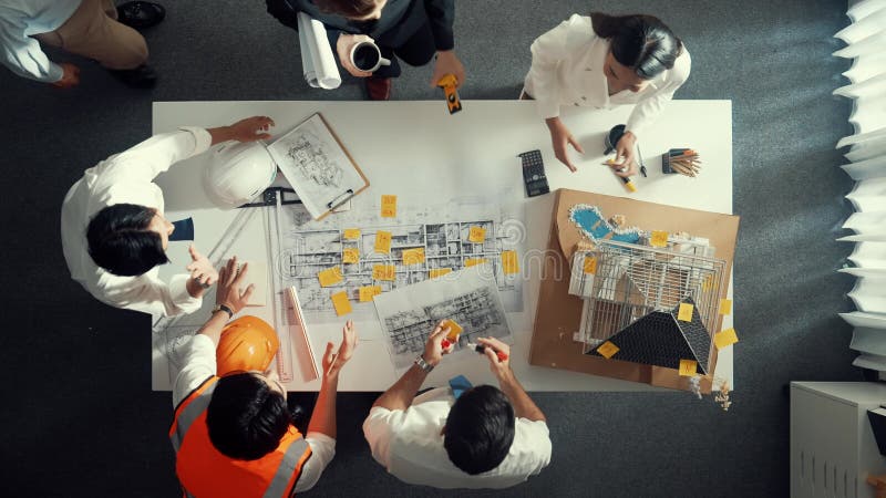 Top View of Engineer Working Together To Plan Building at Meeting ...