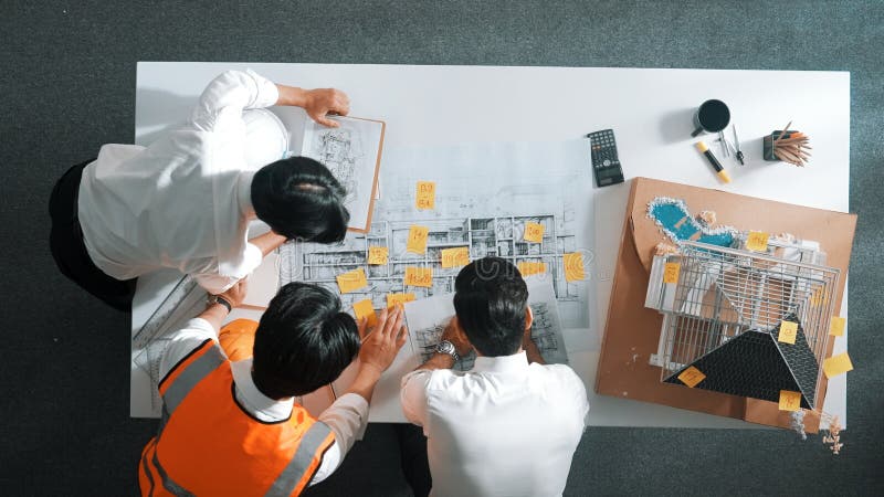 Top View of Engineer Working Together To Plan Building at Meeting ...