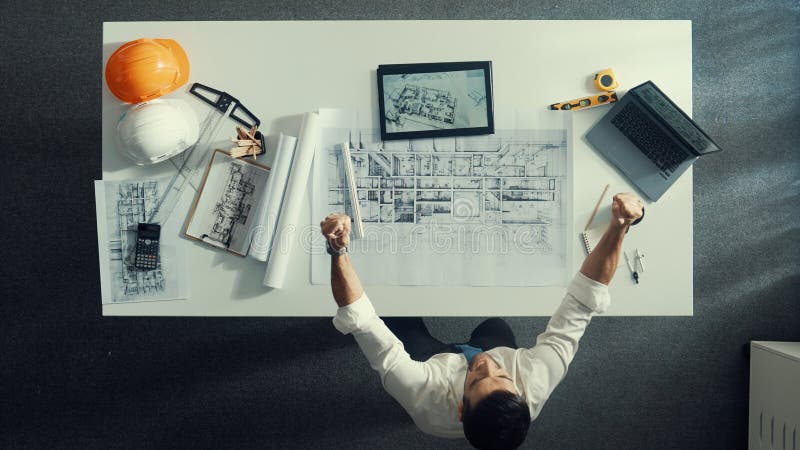 Top Down View of Engineer Talk To Manager by Using Mobile Phone ...