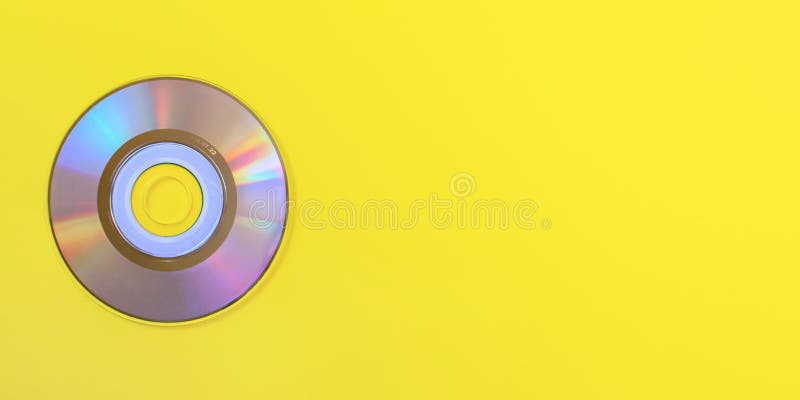 Top Down View, Small CD Shiny / Rainbow Side, on Yellow Board, Space ...