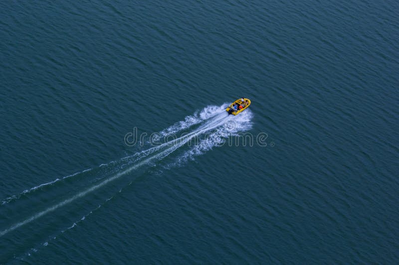 A Top-down View of the Speed of a Motorboat Sailing on Water Stock ...