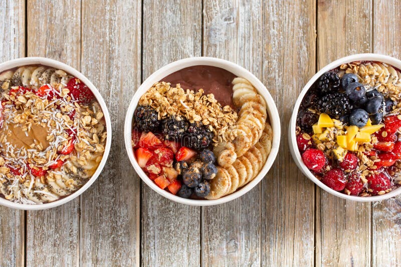 Three acai bowls stock photo. Image of berry, mango - 276723536
