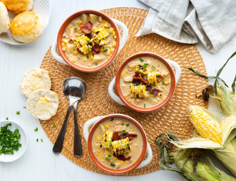 Top Down View of Three Bowls of Chicken and Corn Chowder Soup Served ...
