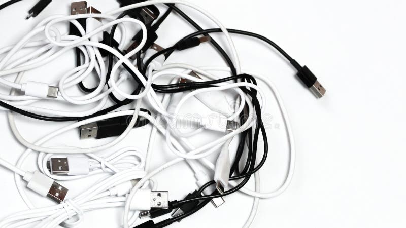 Top Down View-up of Many Tangled Usb Cords Cables on White Cluttered ...