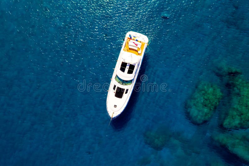 Top Down View of White-yellow Cruise Boat on a Blue Water Stock Image ...