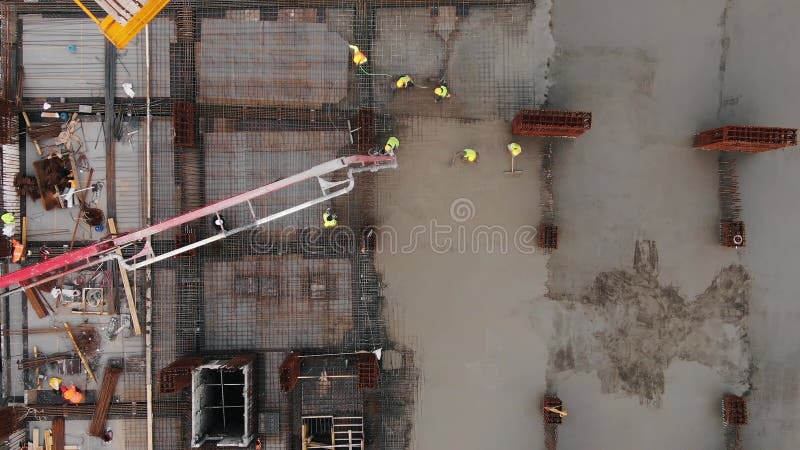 Top Down View of Workers at a Construction Site Pouring Concrete ...
