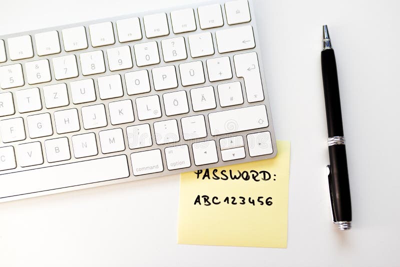 Top Down View of Yellow Adhesive Note with Unsafe Password Under ...