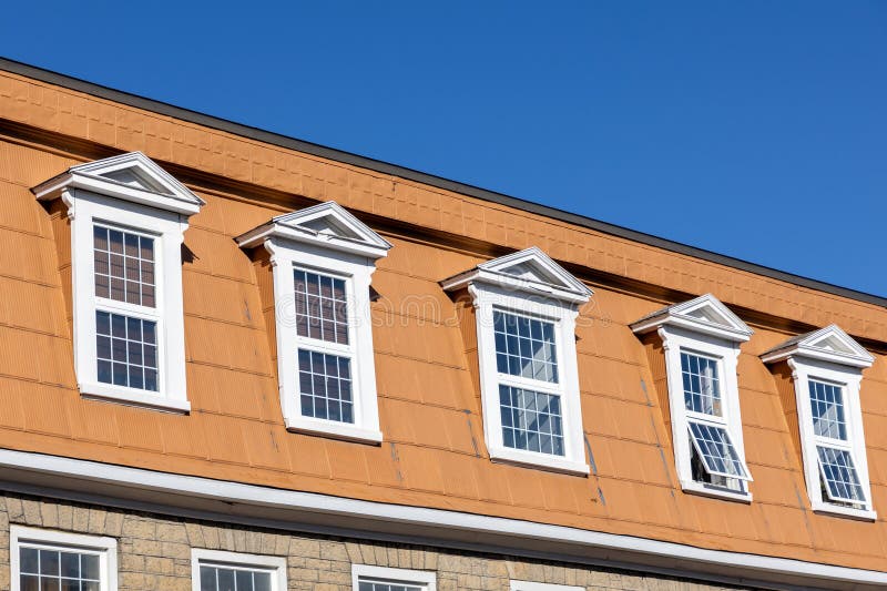The Top Floor of a Residential Building. Row of Windows of a House ...